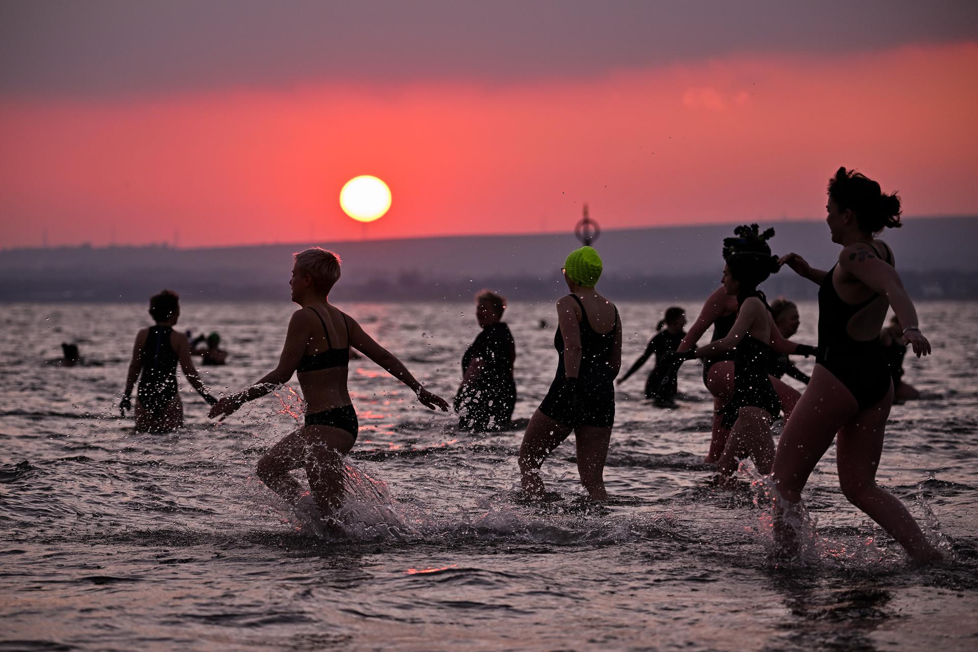 Women hit the North Sea for a sunrise swim on International Women's Day ...