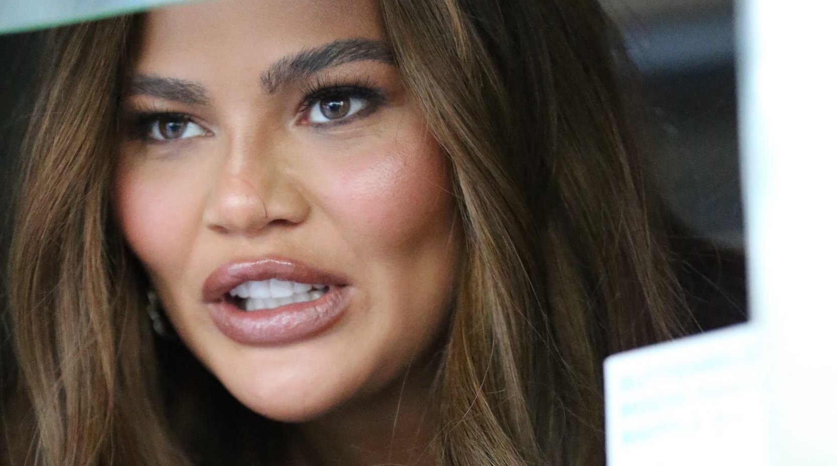 Christine Brooks pictured (left) with her step son and her partner, her sister-in-law (centre ...