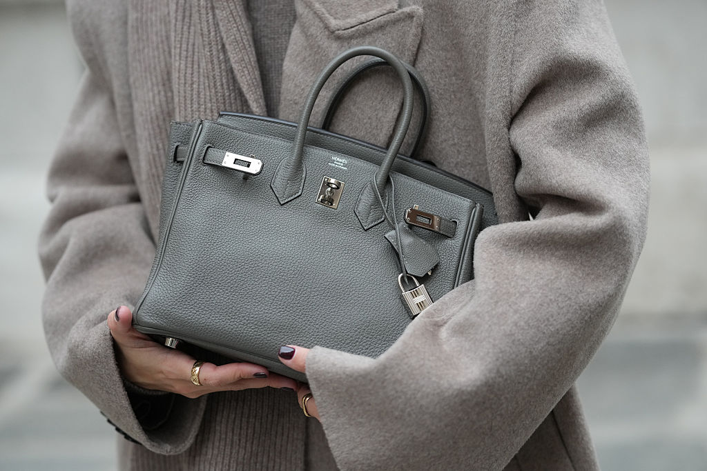 Close-up detail view of a gray Hermes Birkin bag in grained leather. Credit: Edward Berthelot ...